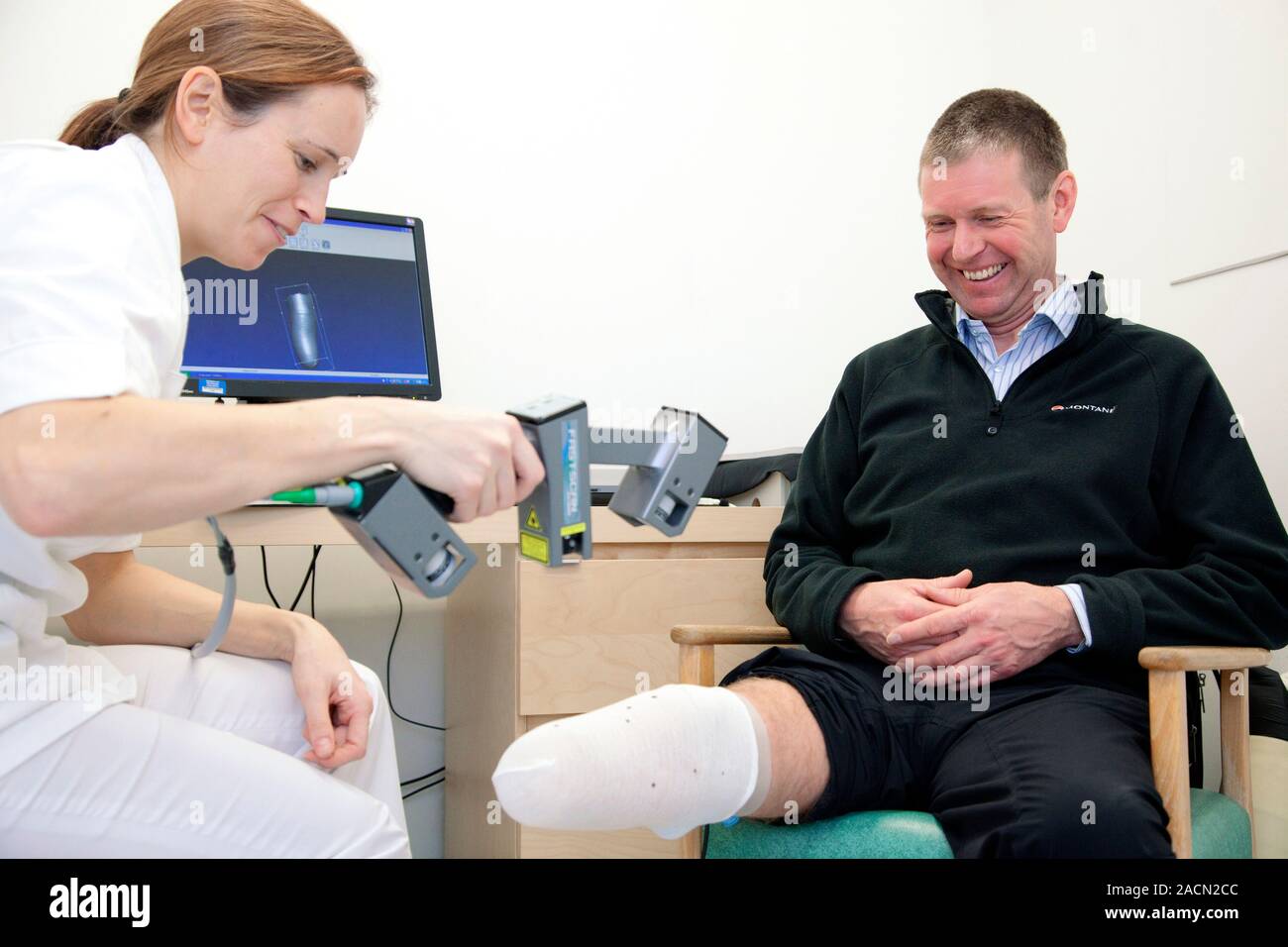 Orthopaedic technician scanning an amputee using polhemus fastSCAN ...