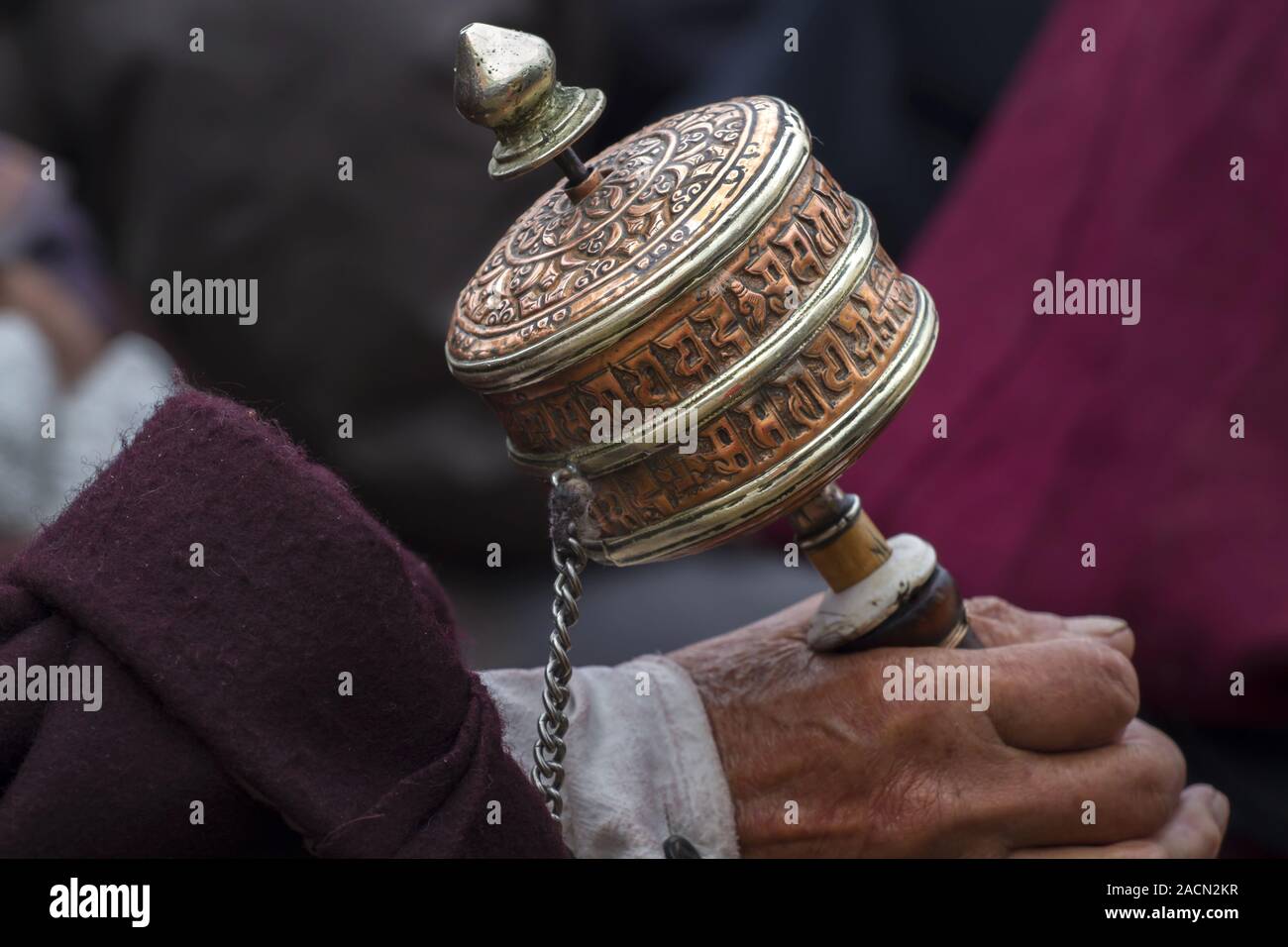 Ladakhi with Tibetan prayer wheel, Ladakh Stock Photo - Alamy