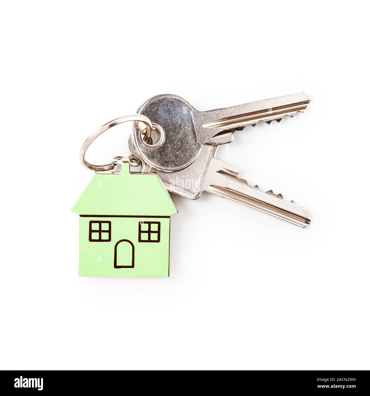 Keys and house shaped green key fob arrangement isolated on white ...
