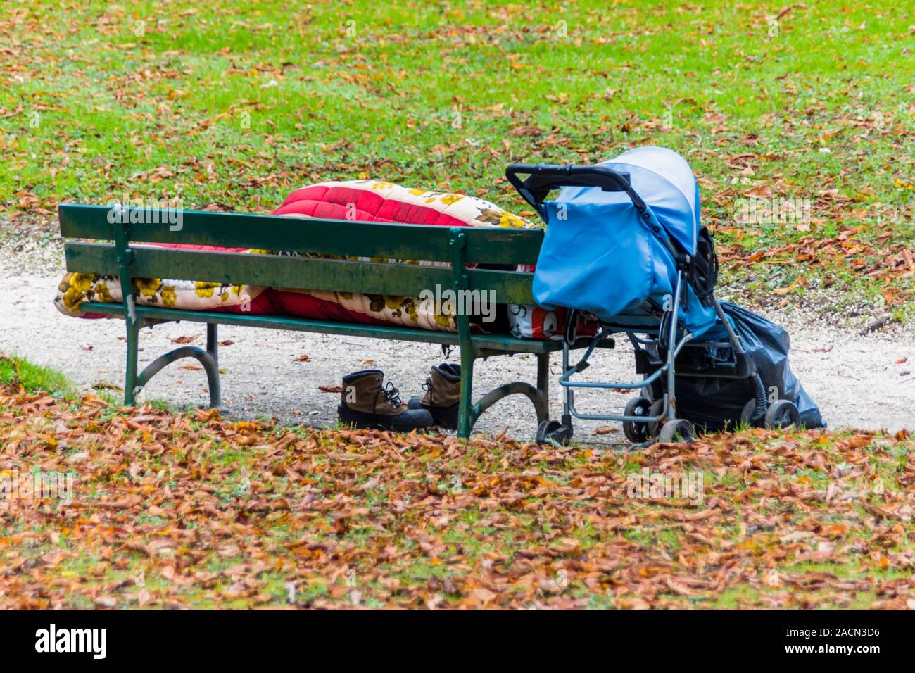 homeless person on a park bench Stock Photo - Alamy