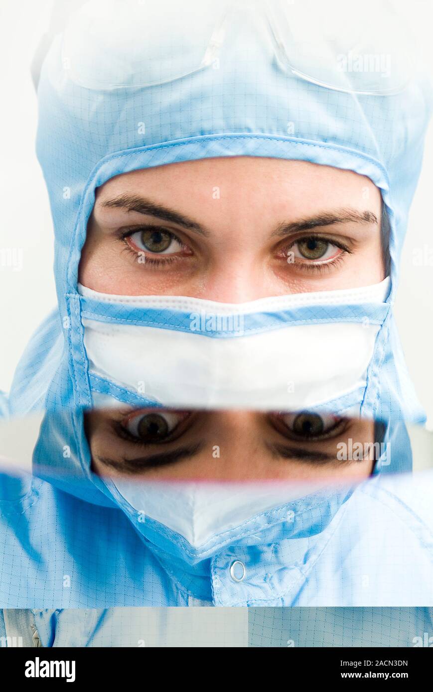 Cleanroom. Close-up of the face of a woman wearing a cleanroom suit. A ...
