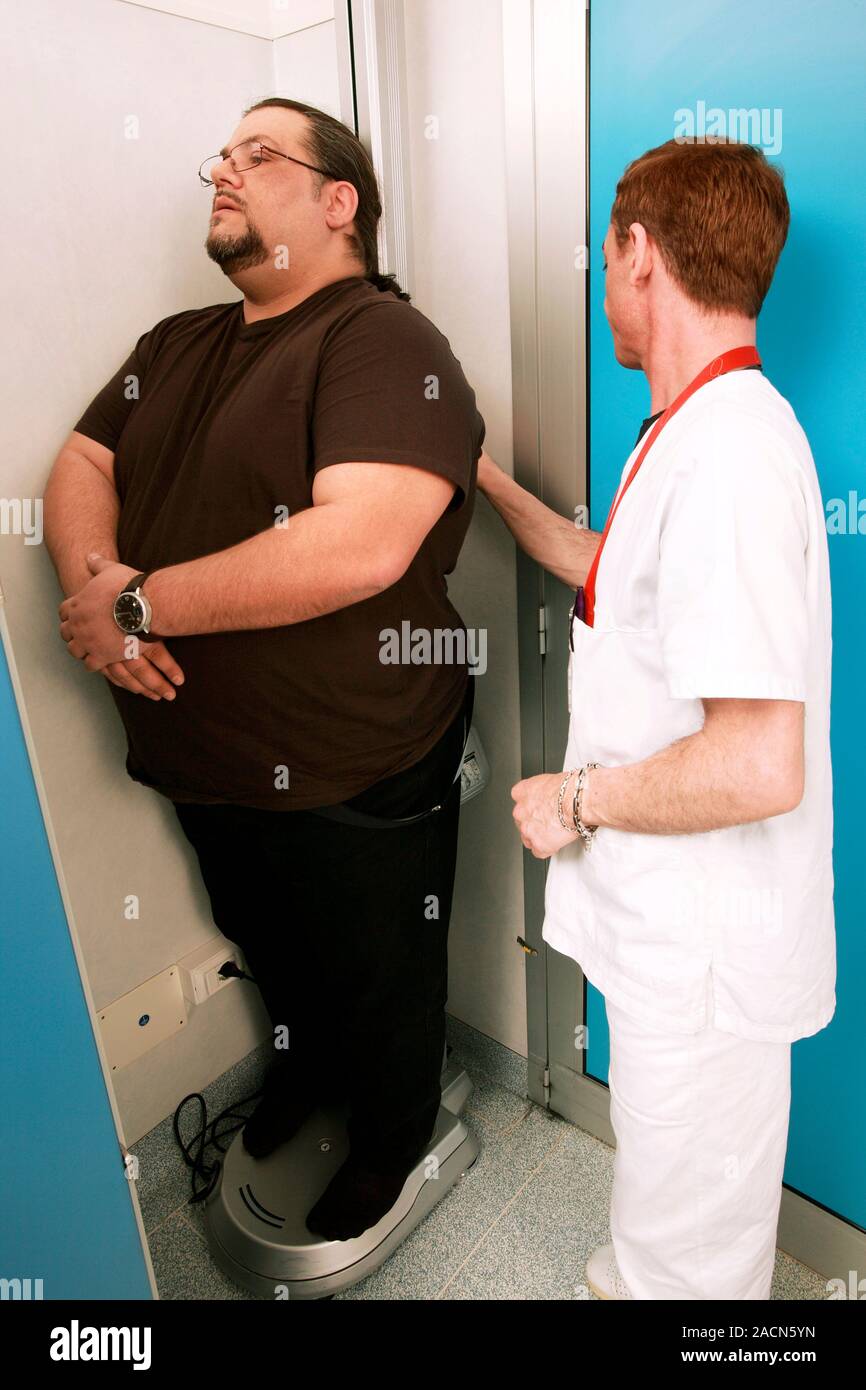 Obesity clinic. Male patient being weighed Stock Photo - Alamy