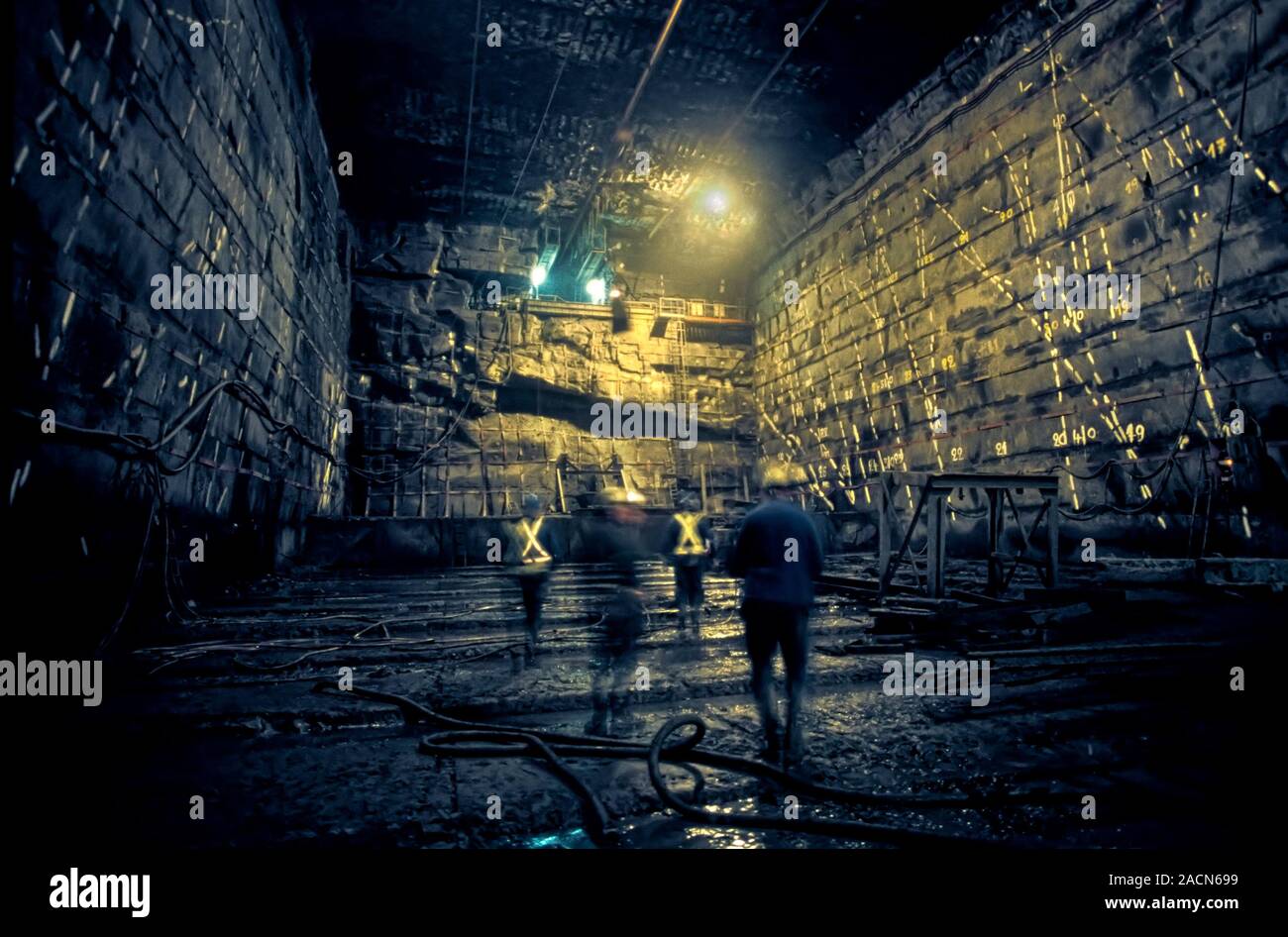 Slate mining. Workers in a large underground chamber at a slate mine ...