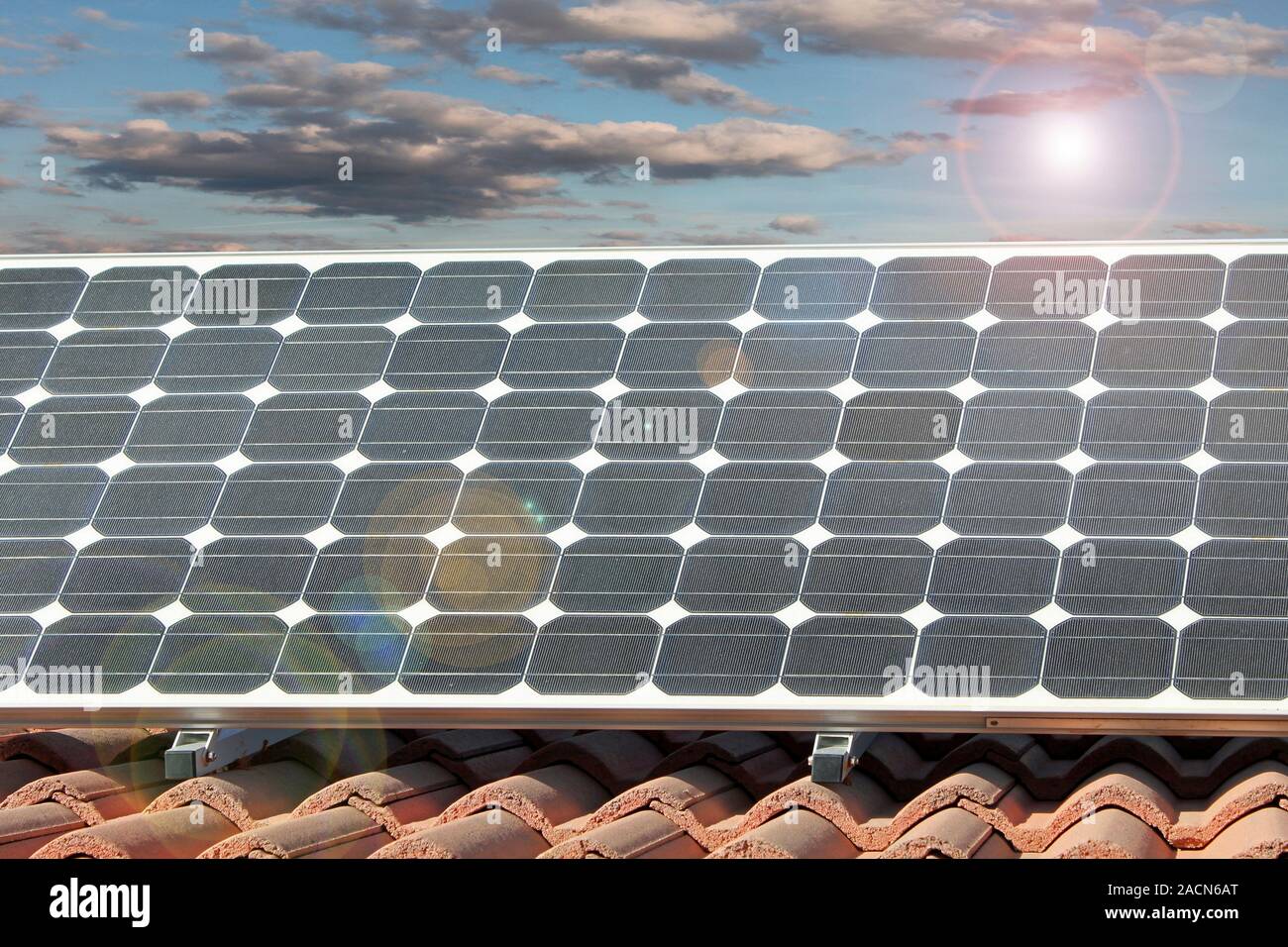 Solar panel array on a rooftop. Solar panels generate electricity by ...