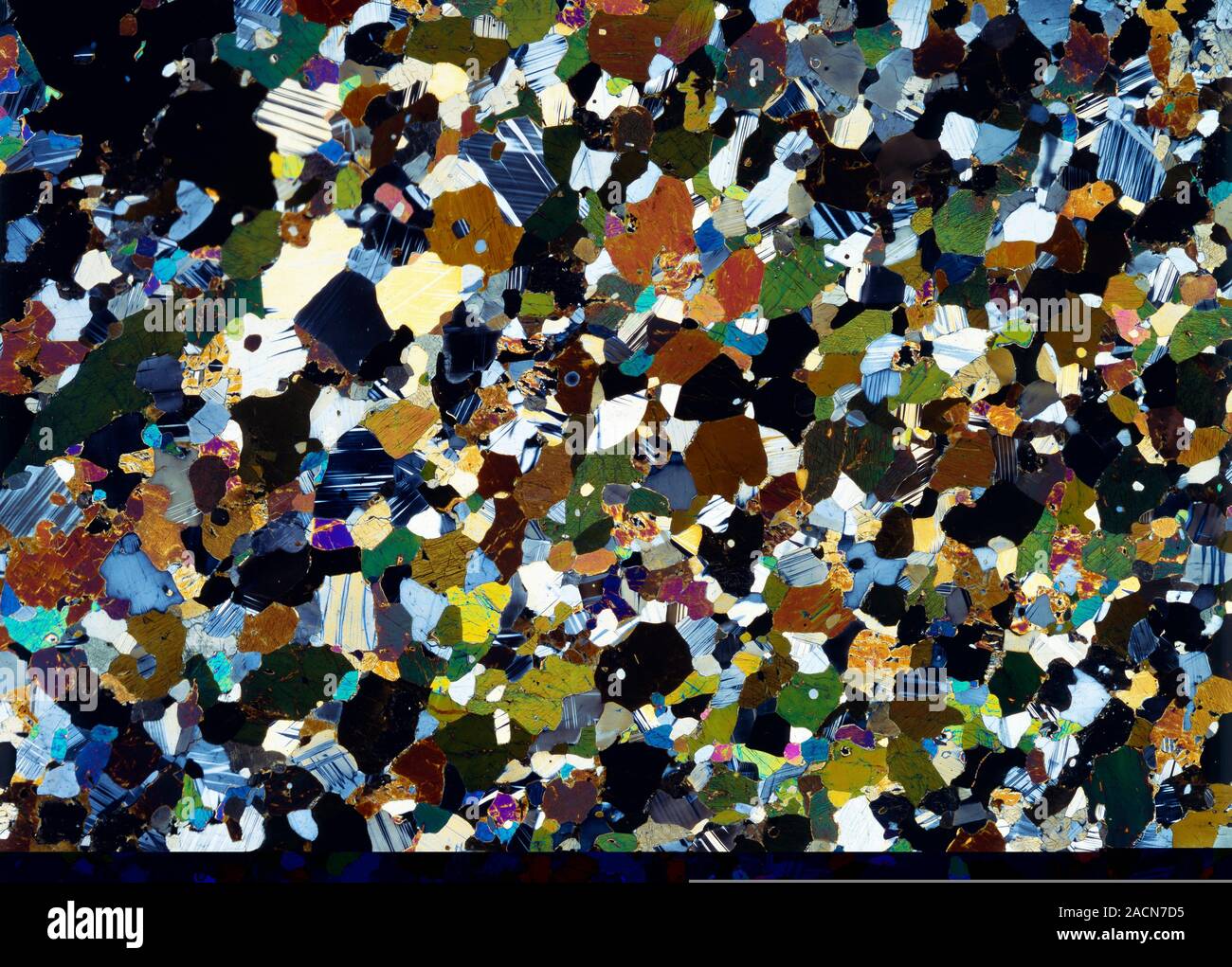 Granulite mineral. Polarised light micrograph of an alkaline granulite ...