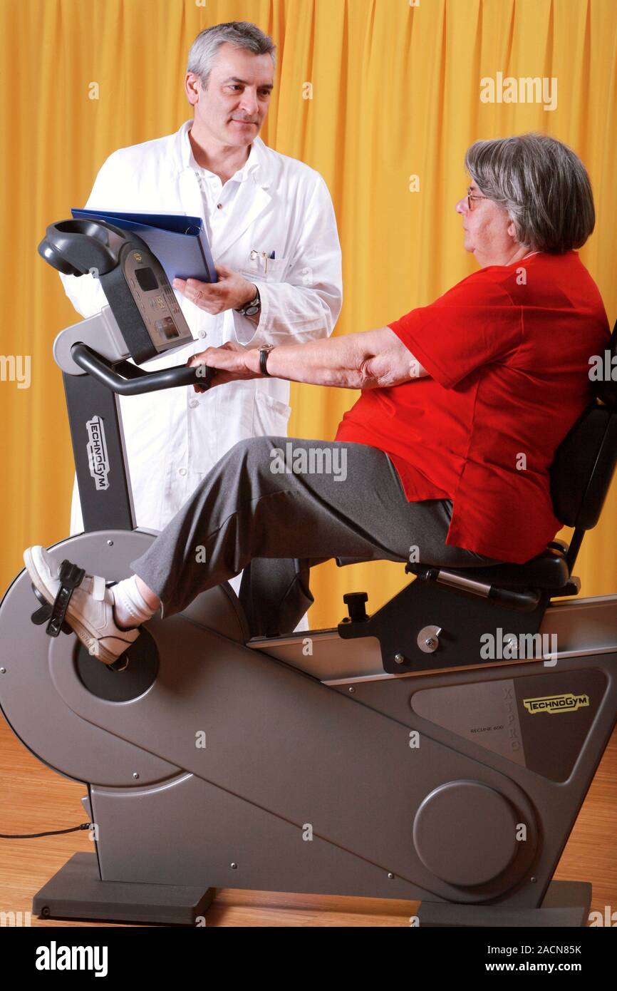 Obesity clinic. Female patient using an exercise bike Stock Photo - Alamy