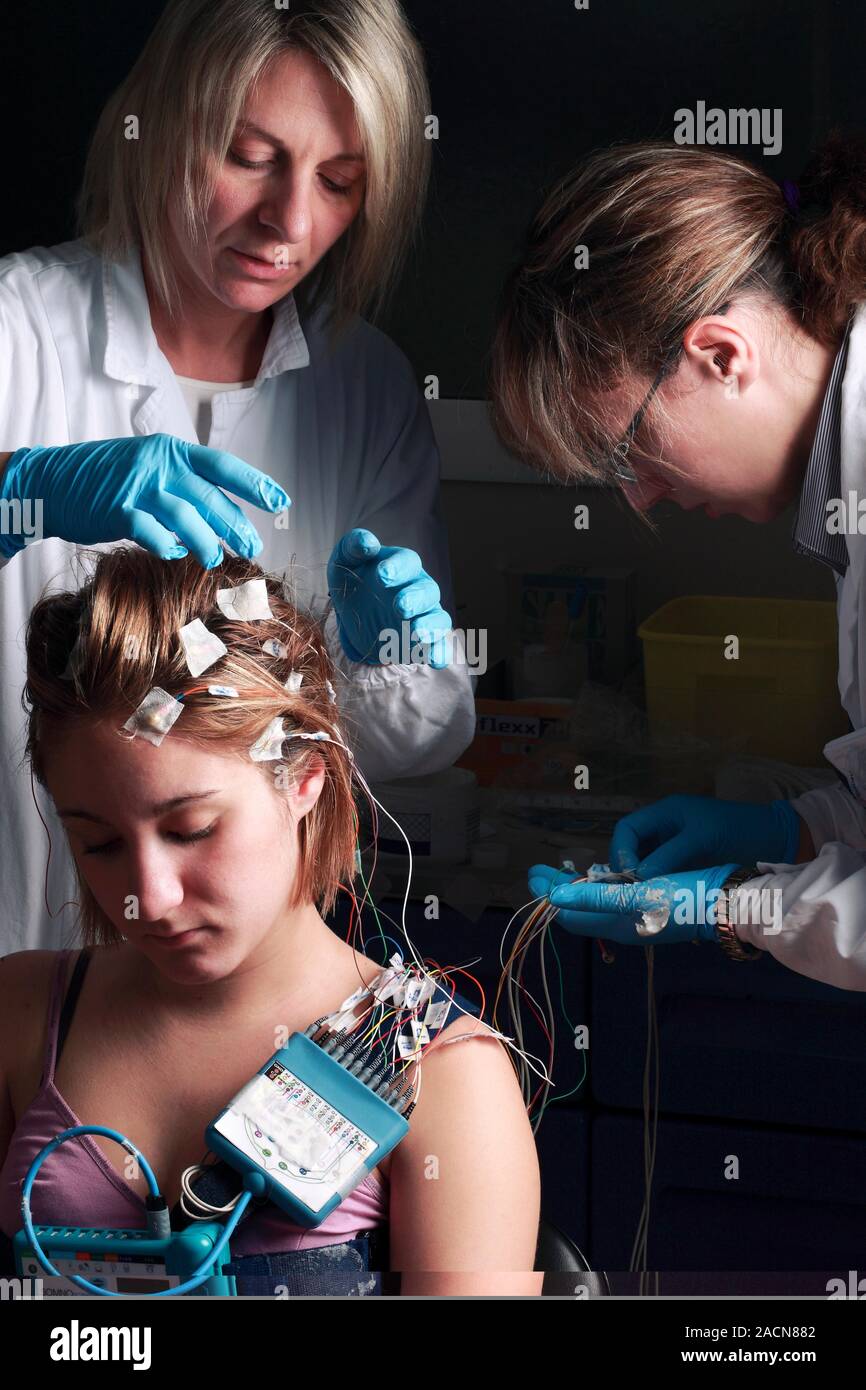 Electroencephalography. Neurologist placing electroencephalography (EEG ...
