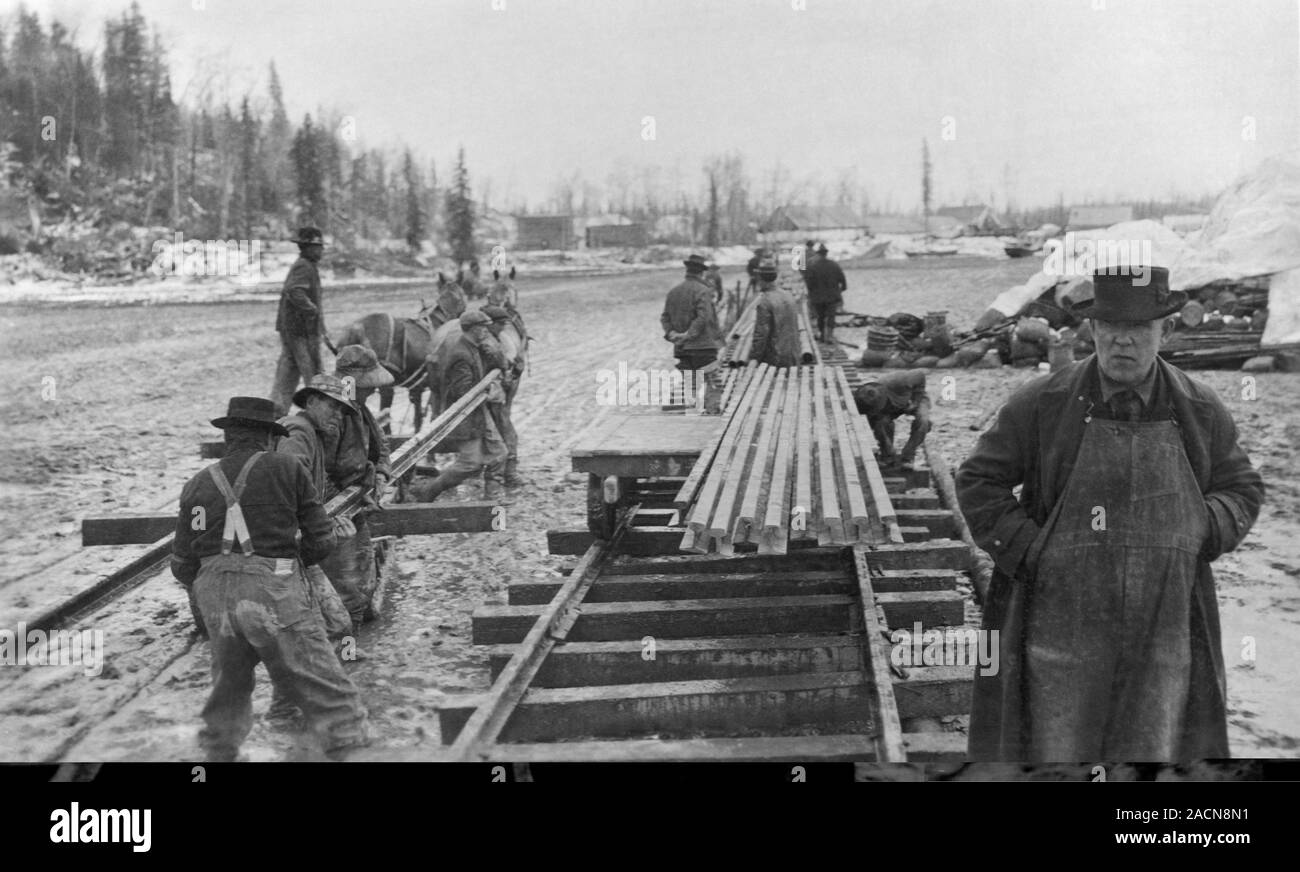 Alaska Railroad construction. Railroad workers and engineers laying the ...