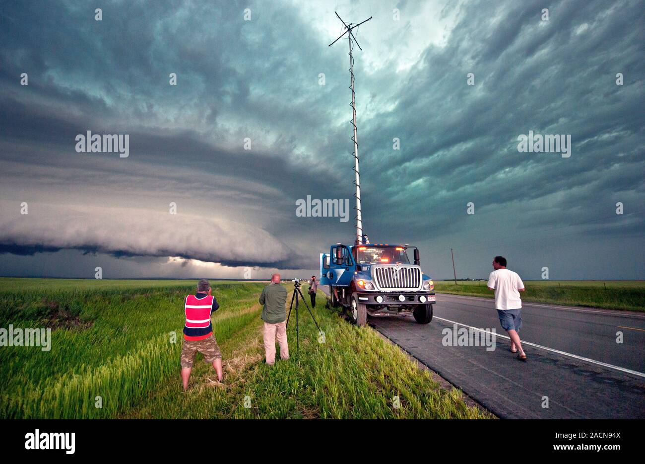 Storm chasing. Tornado researchers outside a Doppler on Wheels (DOW ...
