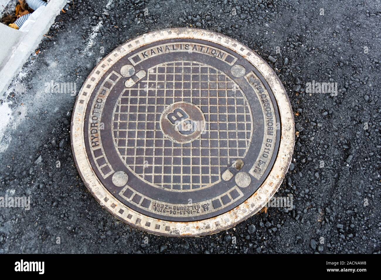 Cover for sewer system Stock Photo - Alamy