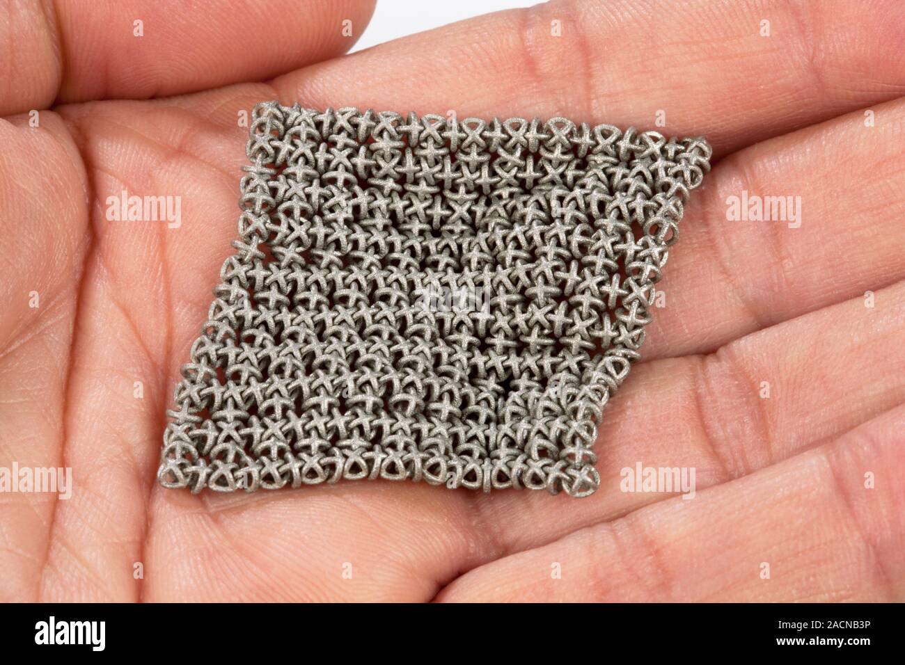 3D printed chain mail. Person holding intricately designed chainmail ...