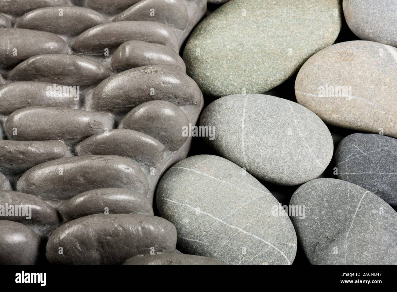 Artificial pebbles. Close-up of a building material (left) made to ...