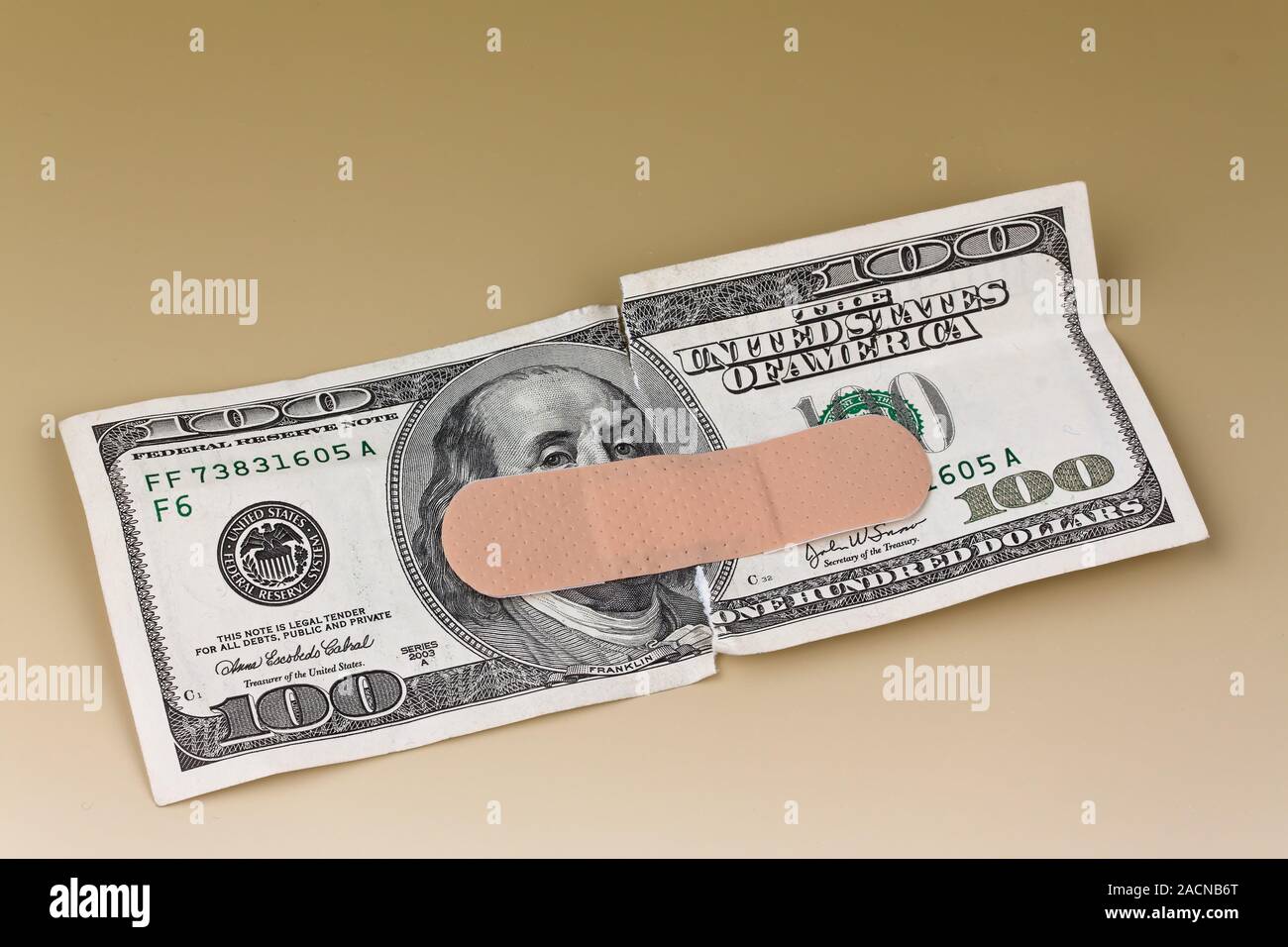 Dollar banknotes with a band-aid Stock Photo - Alamy