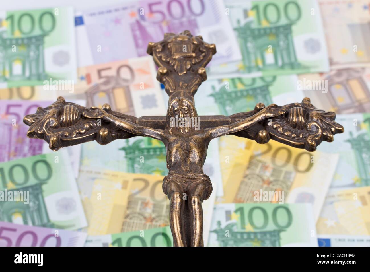 Euro banknotes with a cross Stock Photo - Alamy