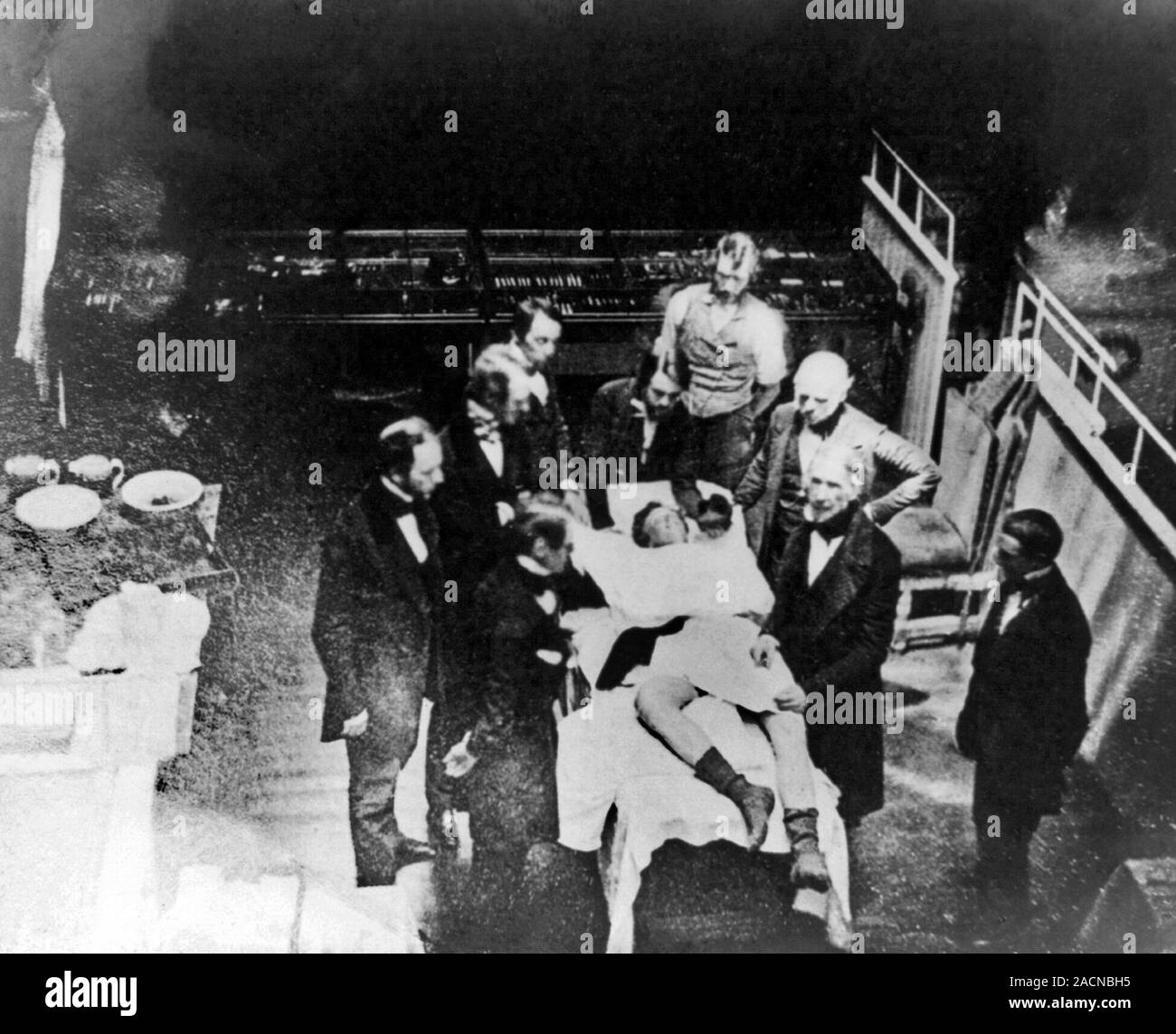 Re-enactment of first anaesthesia. Group of surgeons and a patient re ...