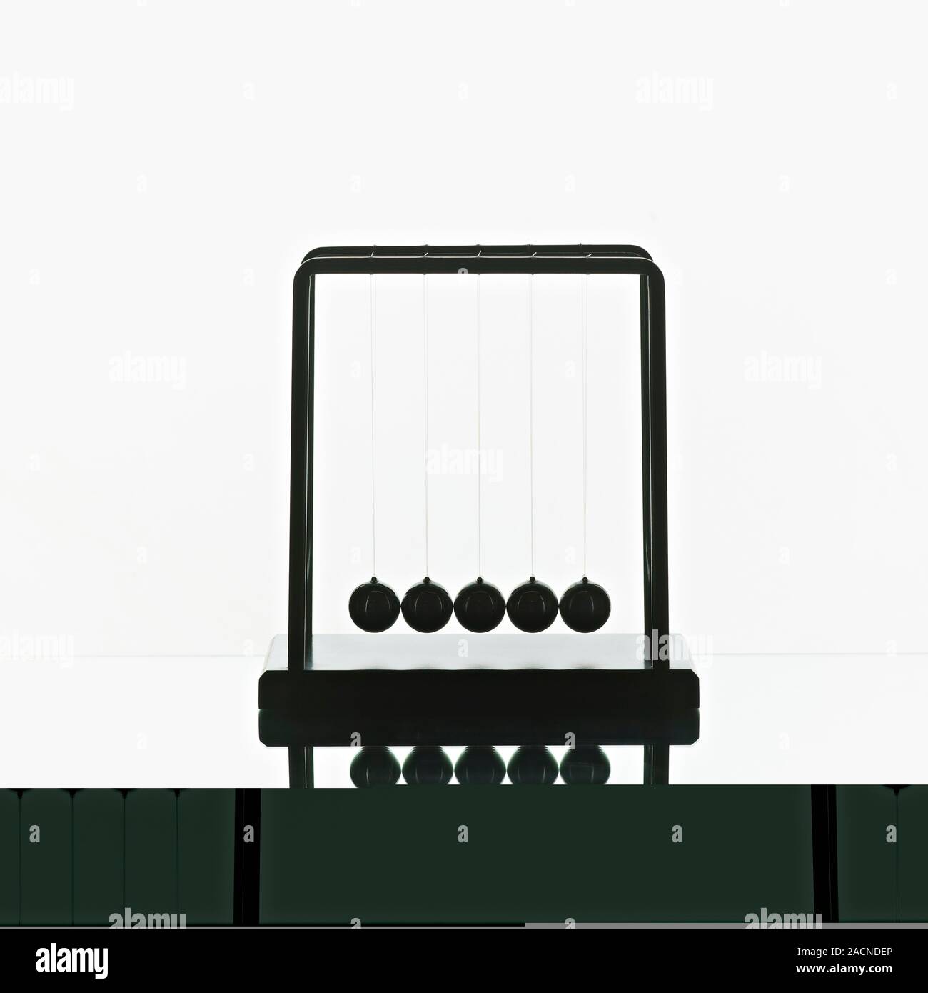 Newton's cradle. This device consists of a number of steel balls ...