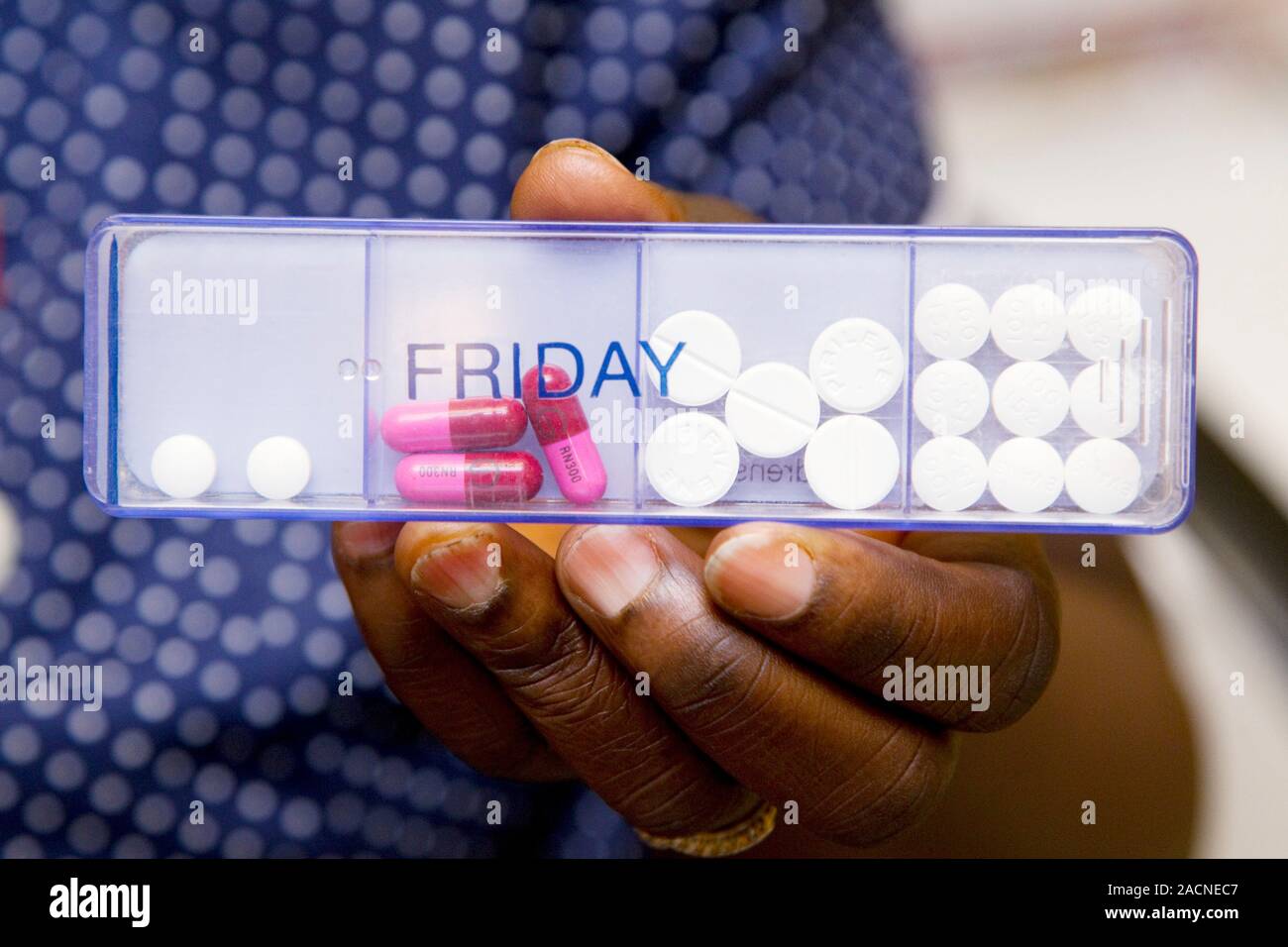 Tuberculosis (TB) drugs. Pill box marked Friday, showing a daily set of ...