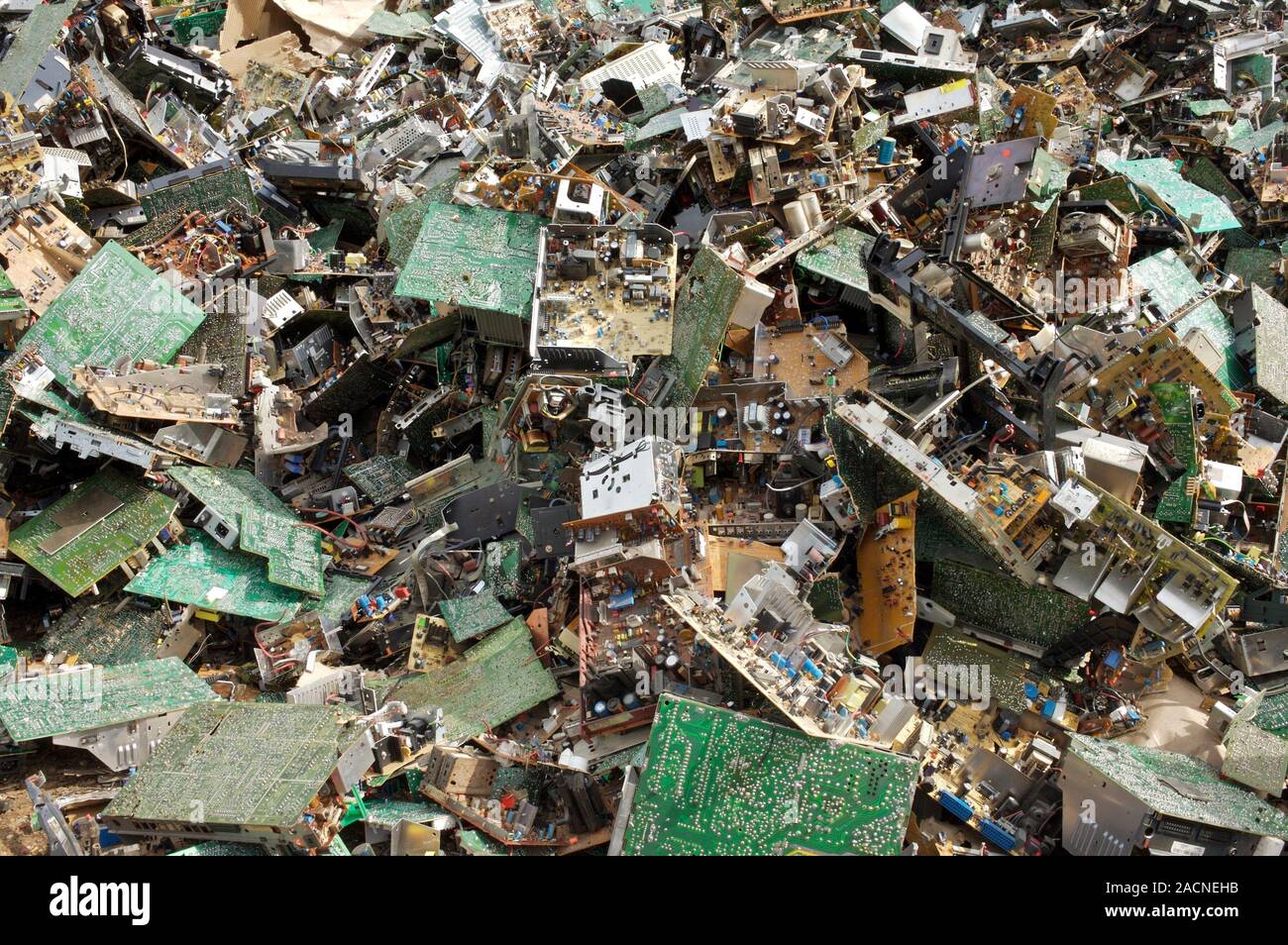 Computer equipment recycling centre. Pile of old computer components ...