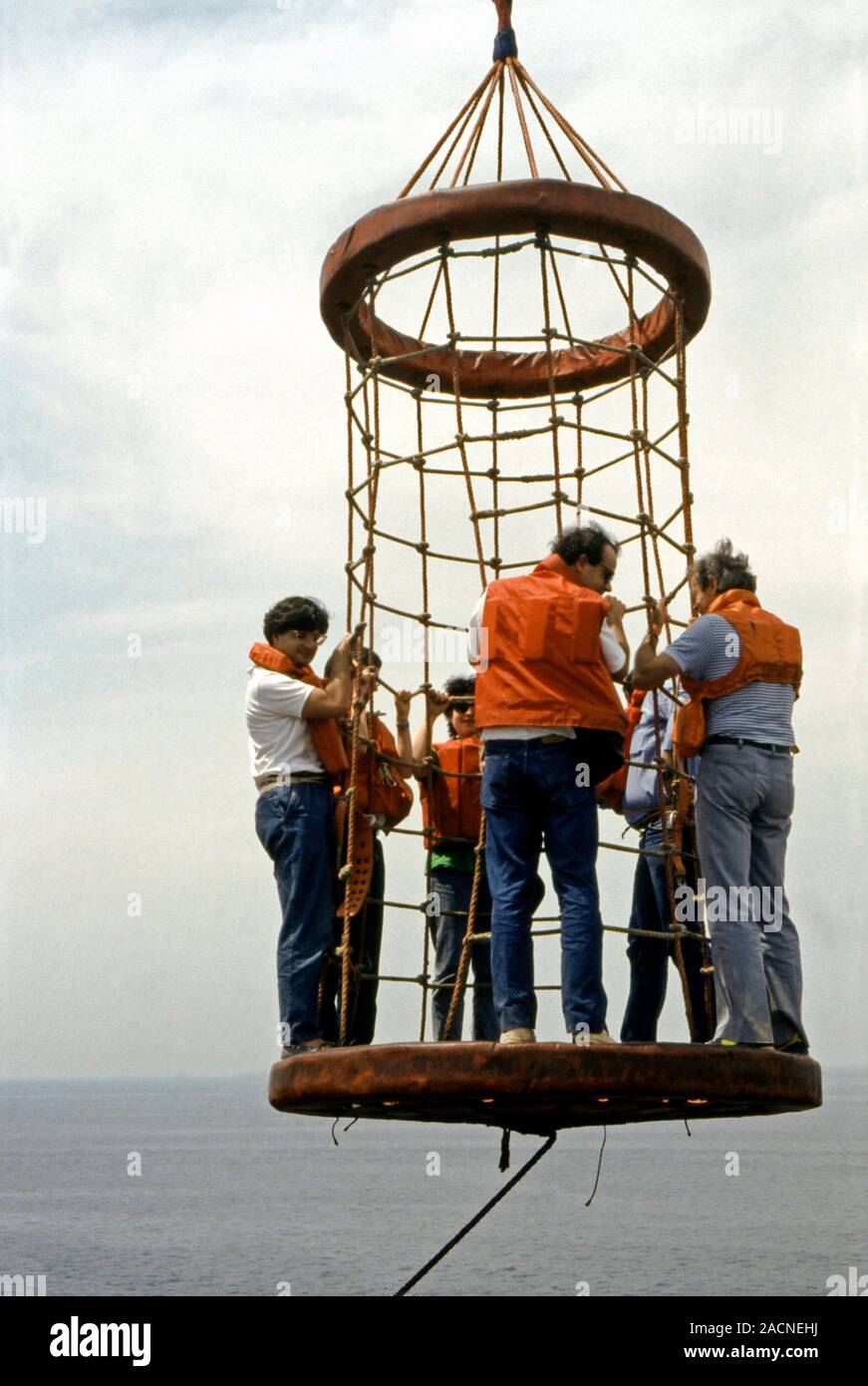 Oil rig. Workers being transferred onto an offshore oil drilling ...