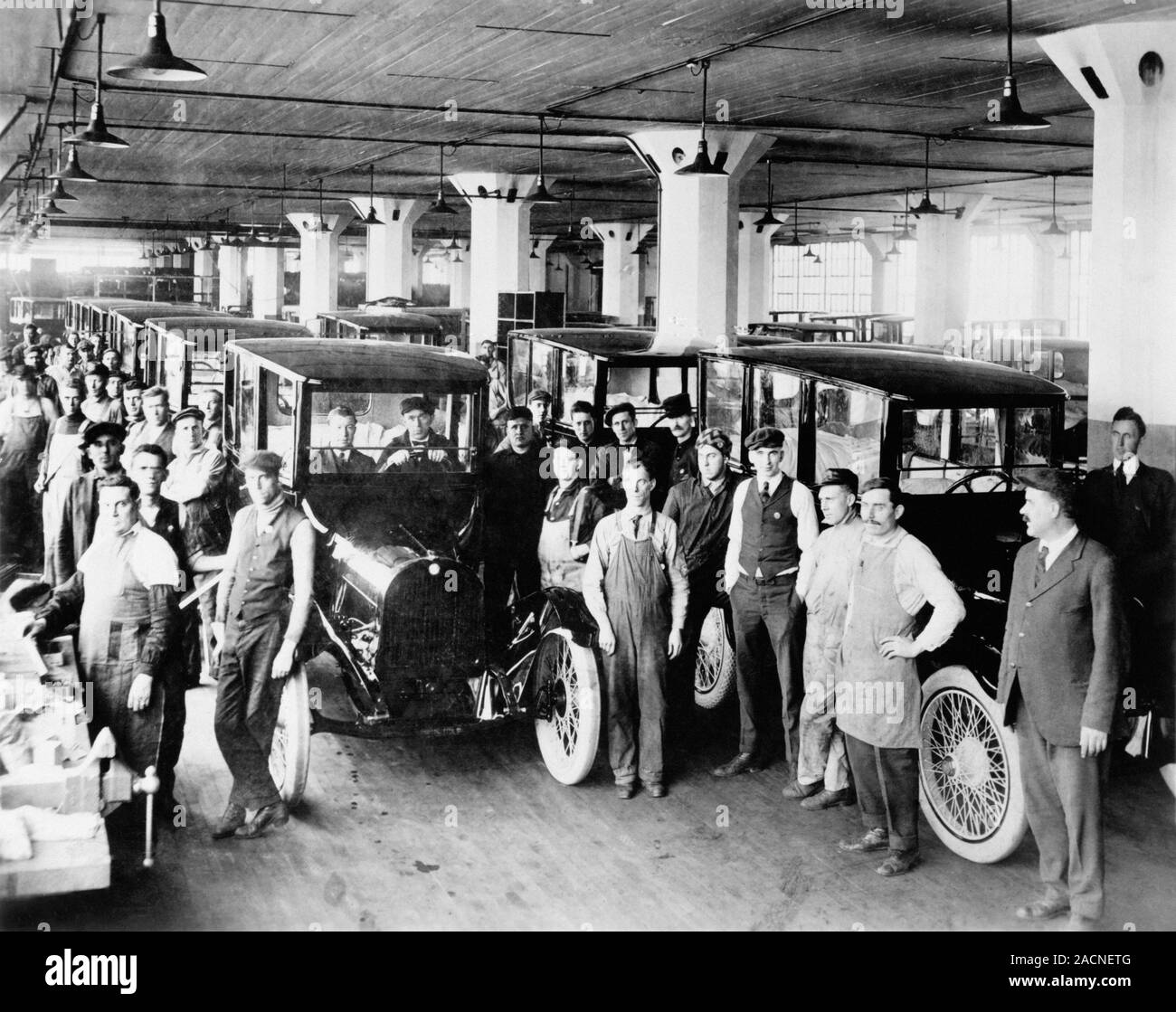 Dodge Brothers automobile factory. Workers assembled next to Dodge 1919 ...