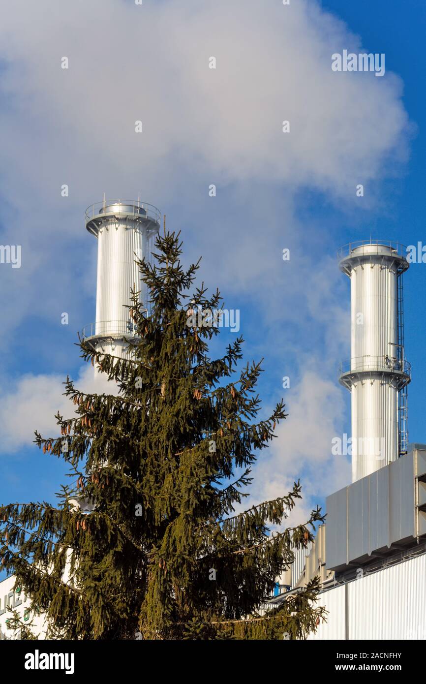 Industrial chimney with tree Stock Photo - Alamy
