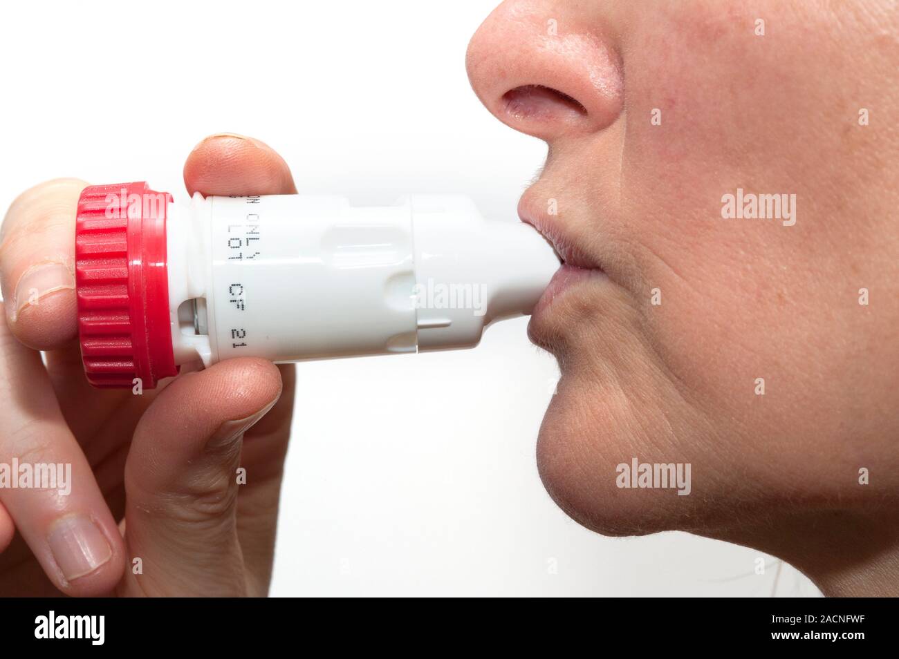 Adult female patient uses a turbohaler to treat asthma or chronic ...