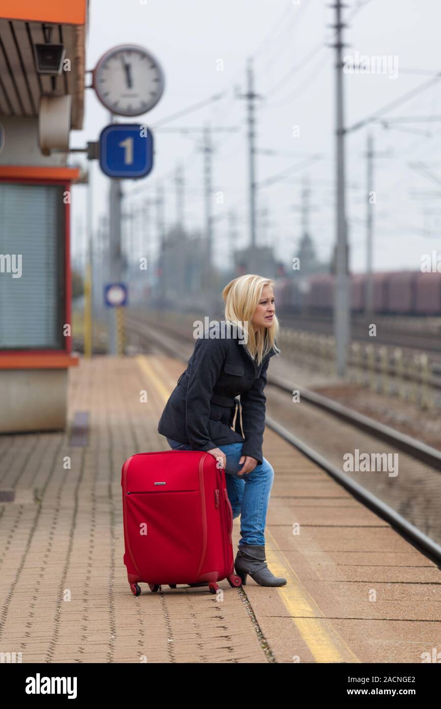 Woman waiting for train hi-res stock photography and images - Alamy