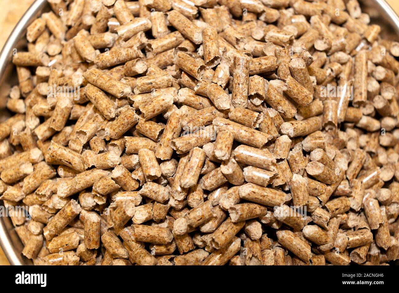 Wood pellet production. Pellets made of compressed wood sawdust at a ...