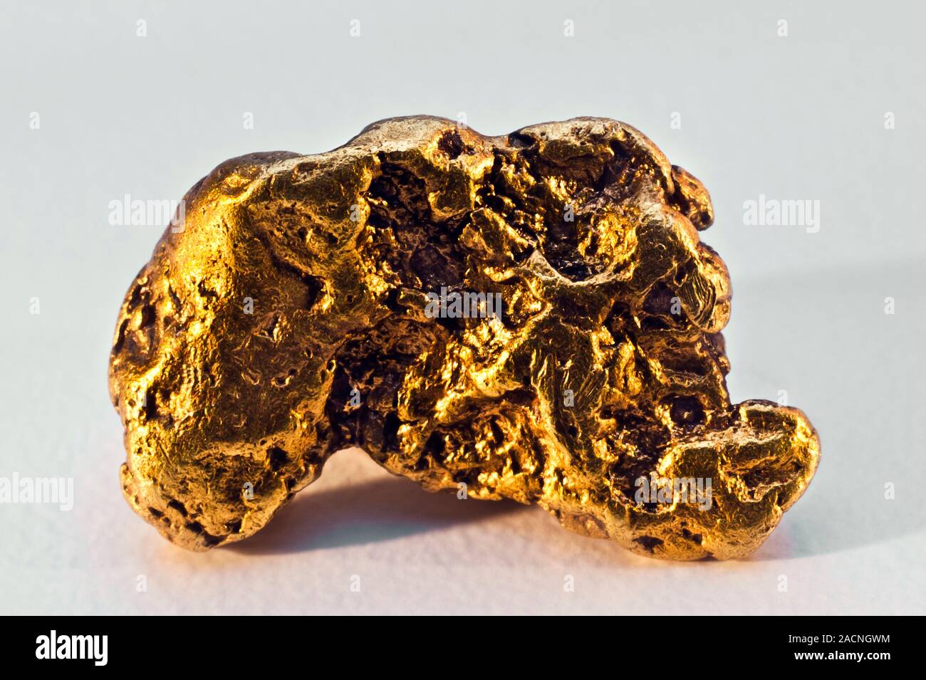 Gold nugget. Gold (Au) is a transition metal element. It has a melting ...