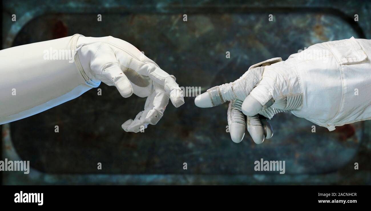 Robonaut and astronaut. Hand of a Robonaut and a spacesuit-gloved human ...
