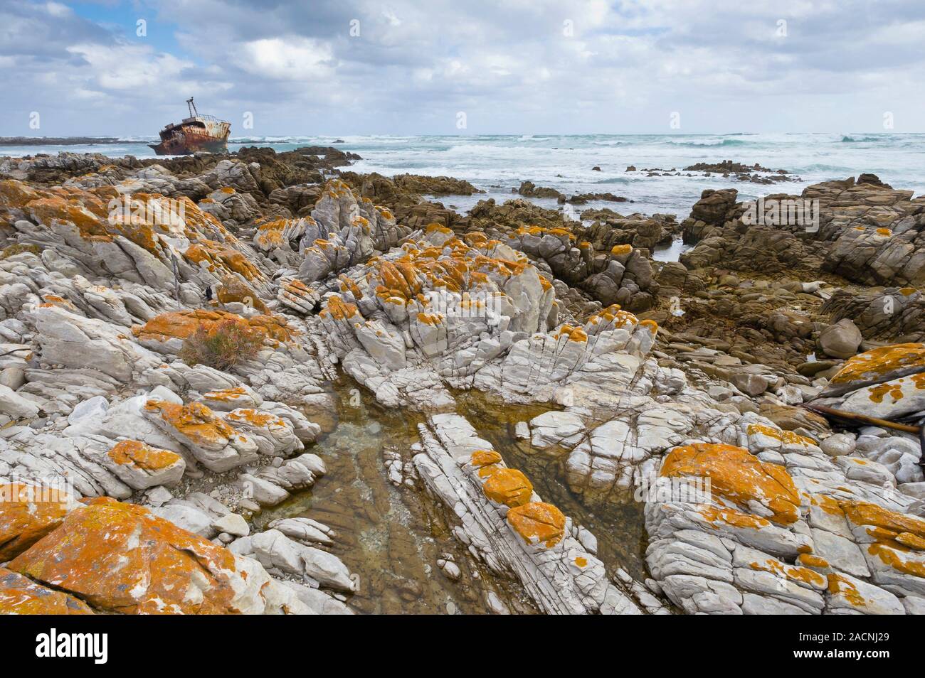 Cape Agulhas. View across rocks on the rugged coastline of Cape Agulhas ...