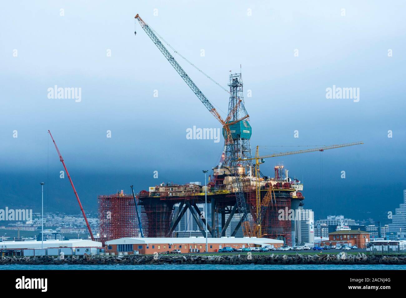 Oil rig undergoing maintenance whilst in harbour. Photographed in Table ...