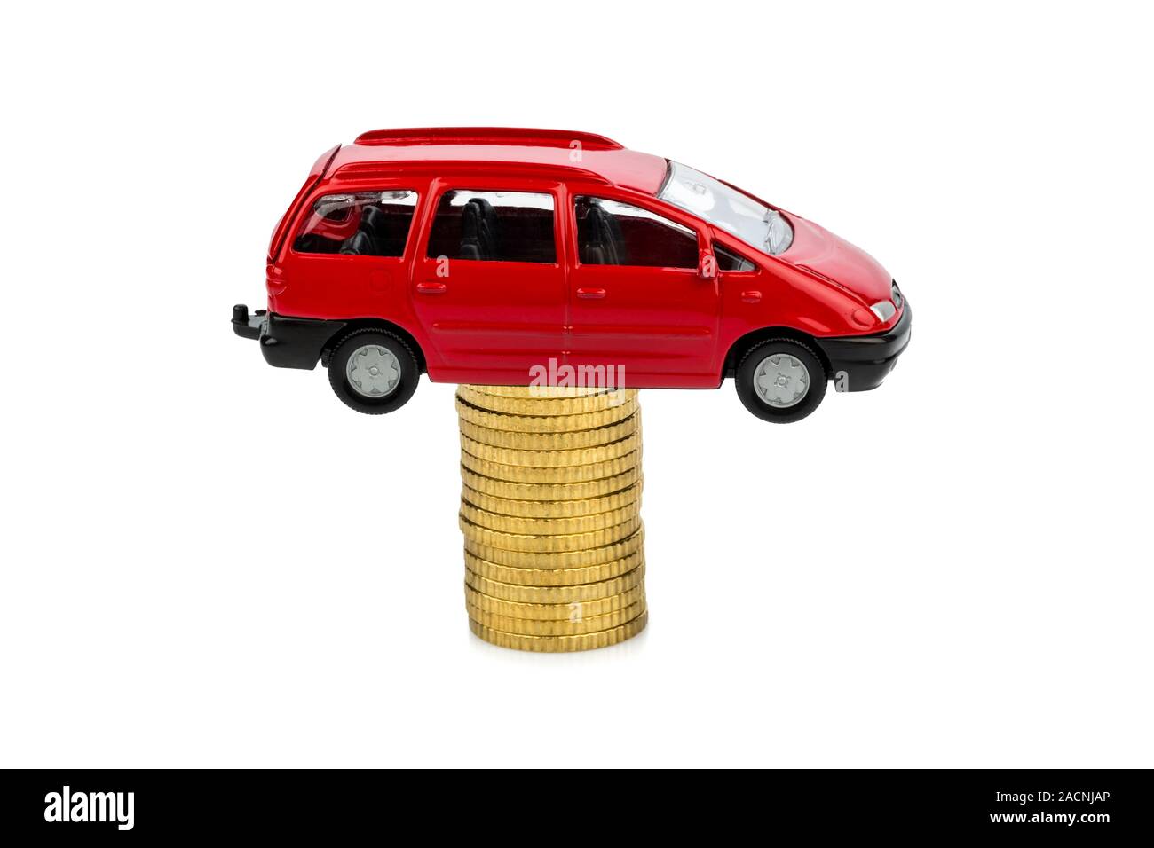 Rising car costs. Car on coins Stock Photo - Alamy