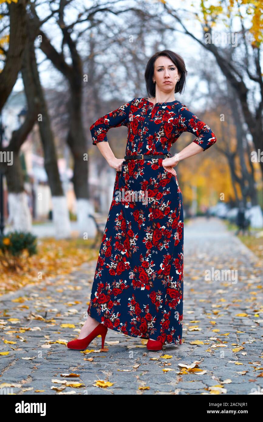 Angry woman posing in a city street, autumn season Stock Photo - Alamy