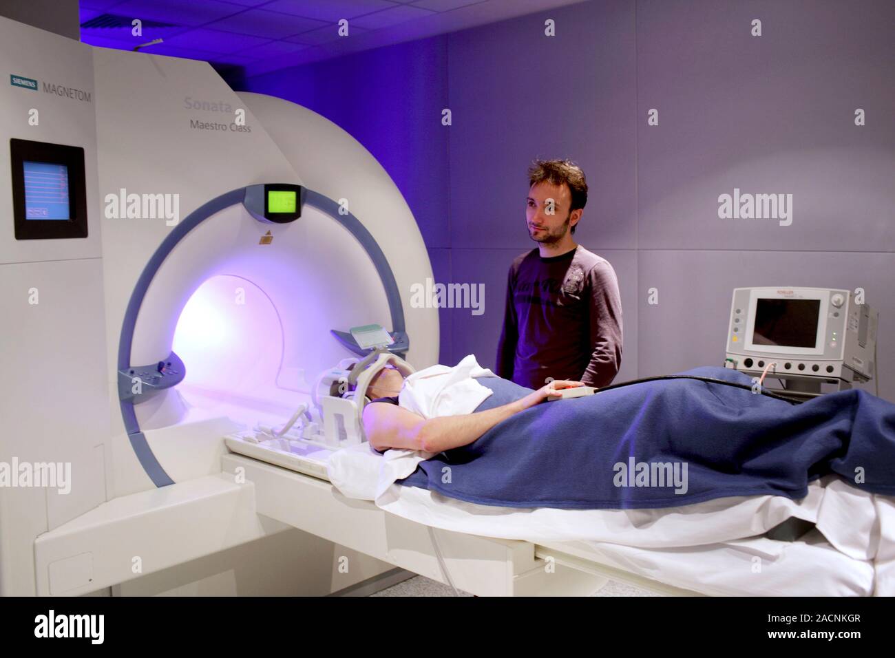 Gambling addiction research. Participant undergoing an MRI (magnetic ...