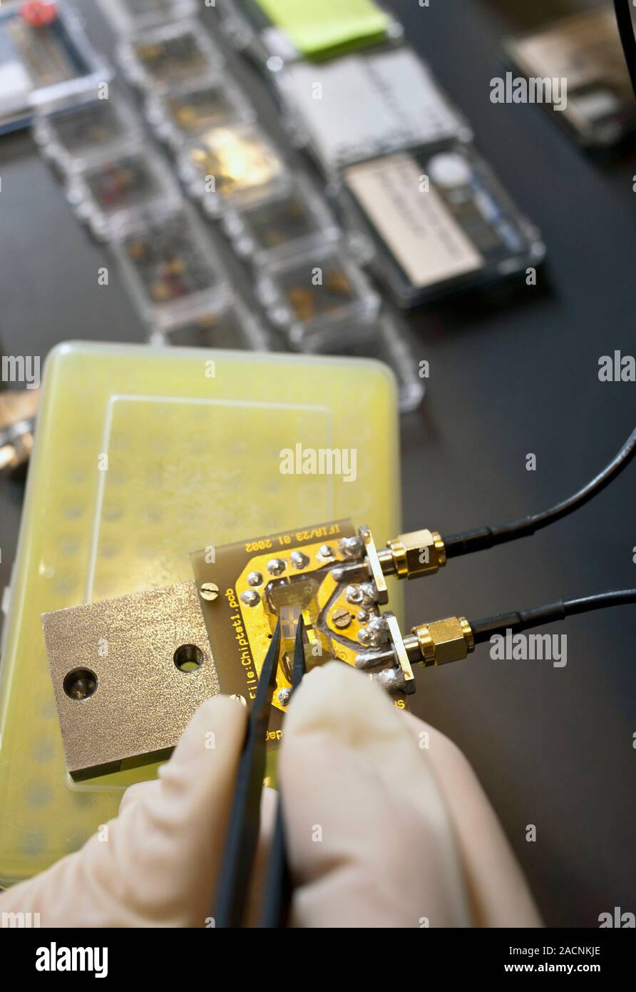 Electrochemical sensor production. Technician holding a chemical sensor ...