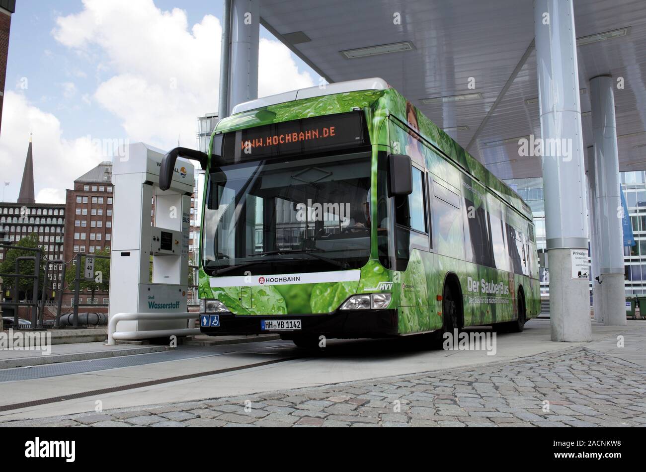 Hydrogen fuel cell bus. Hydrogen fuel cell bus being filled with ...