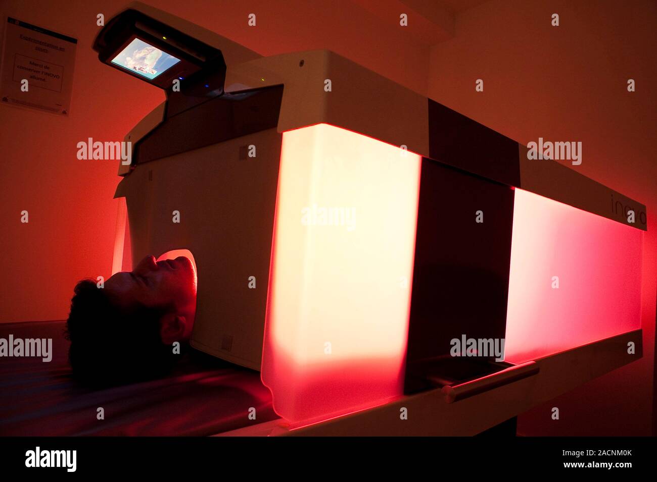 Cryotherapy research. Athlete in an infra-red chamber during research ...