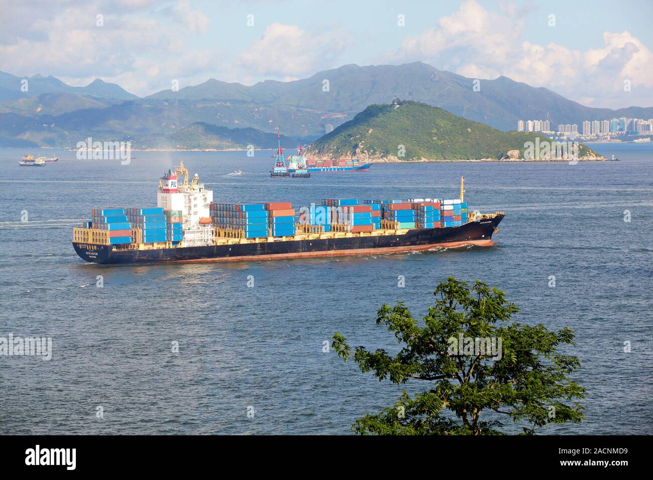 Container ship, Hong Kong. View of a container ship passing through the ...