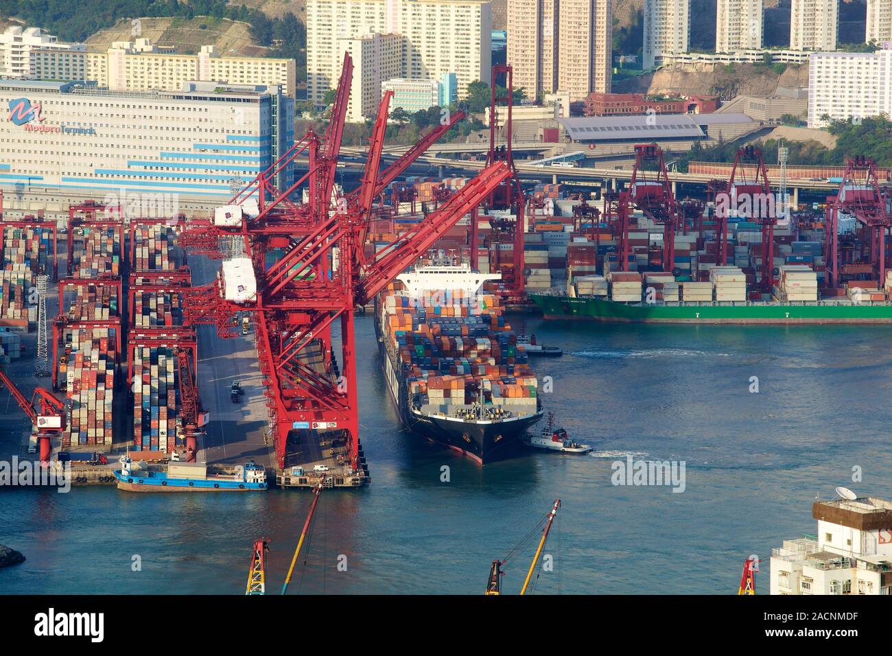 Container port, Hong Kong. View of a container ship docked at the Port ...