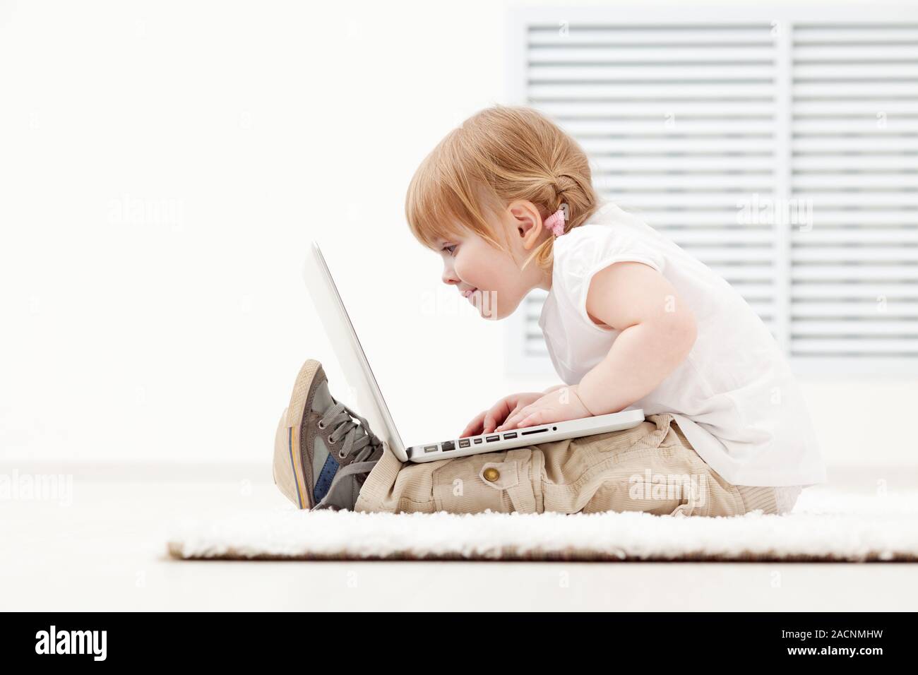 Child with laptop Stock Photo - Alamy