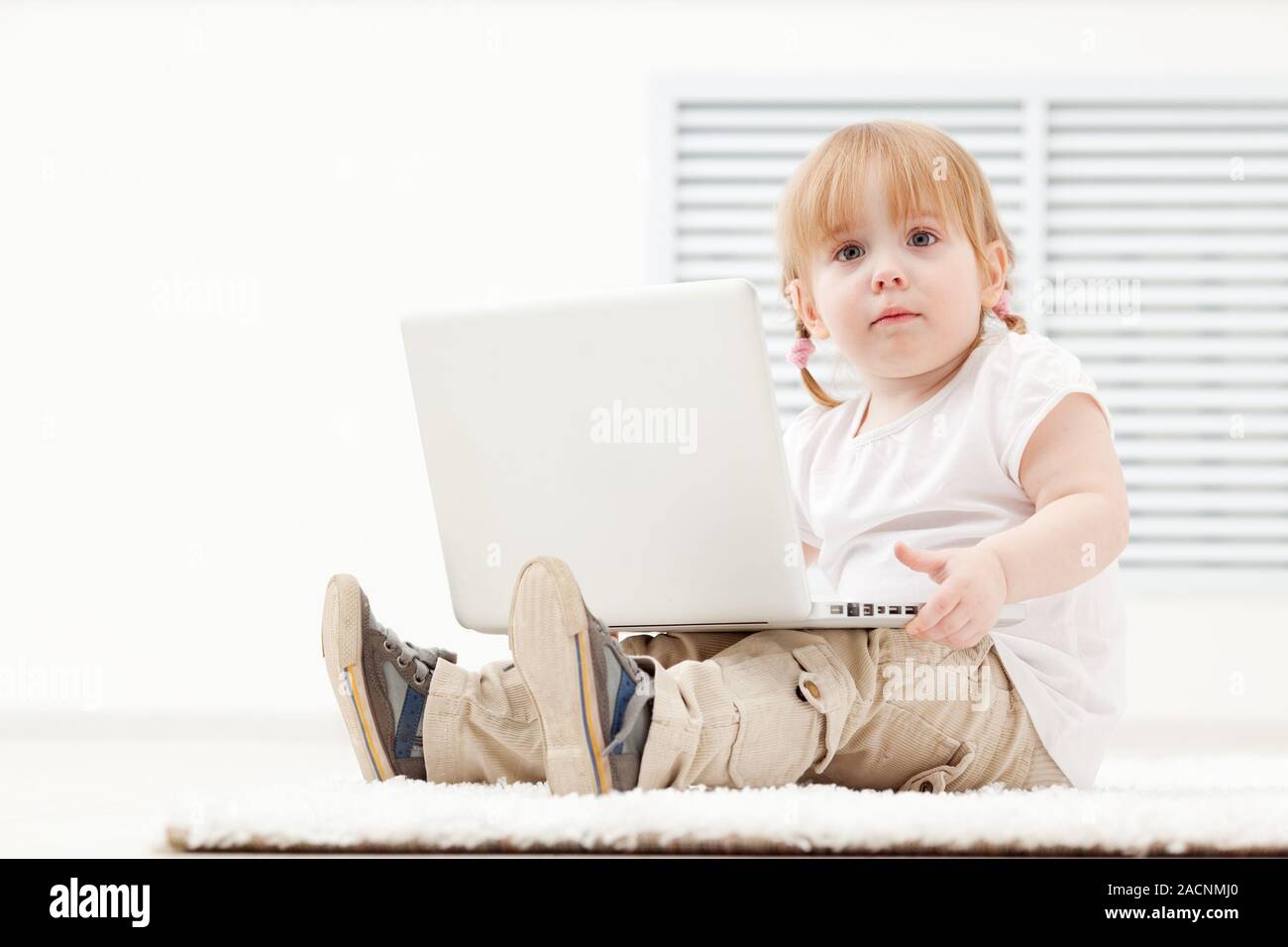 Child with laptop Stock Photo - Alamy