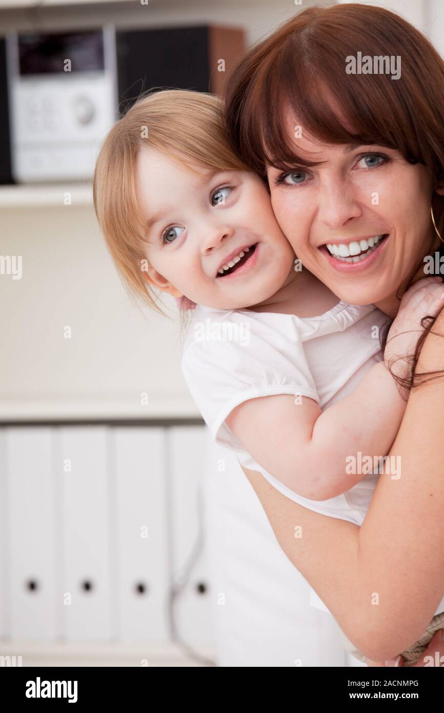 Mother and daughter at home Stock Photo - Alamy