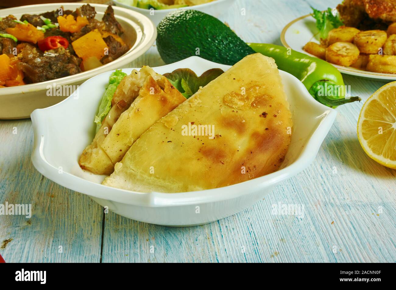 Jamaican beef patties, Caribbean cuisine, Traditional assorted dishes ...