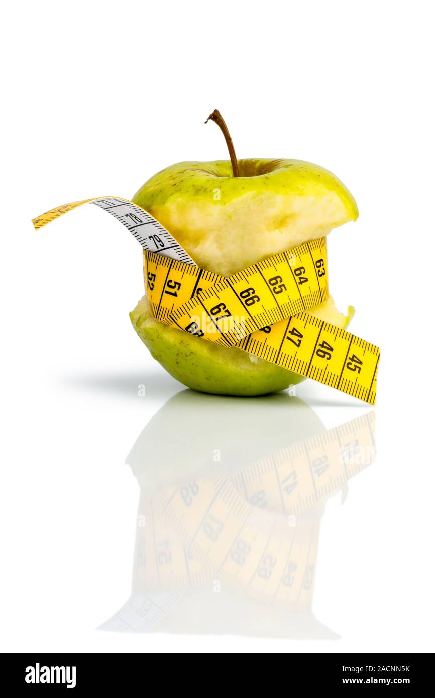 Apple on with tape measure Stock Photo - Alamy