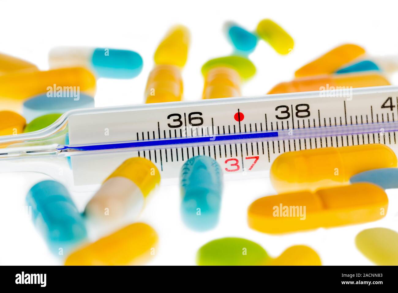 Fever thermometers and tablets Stock Photo - Alamy
