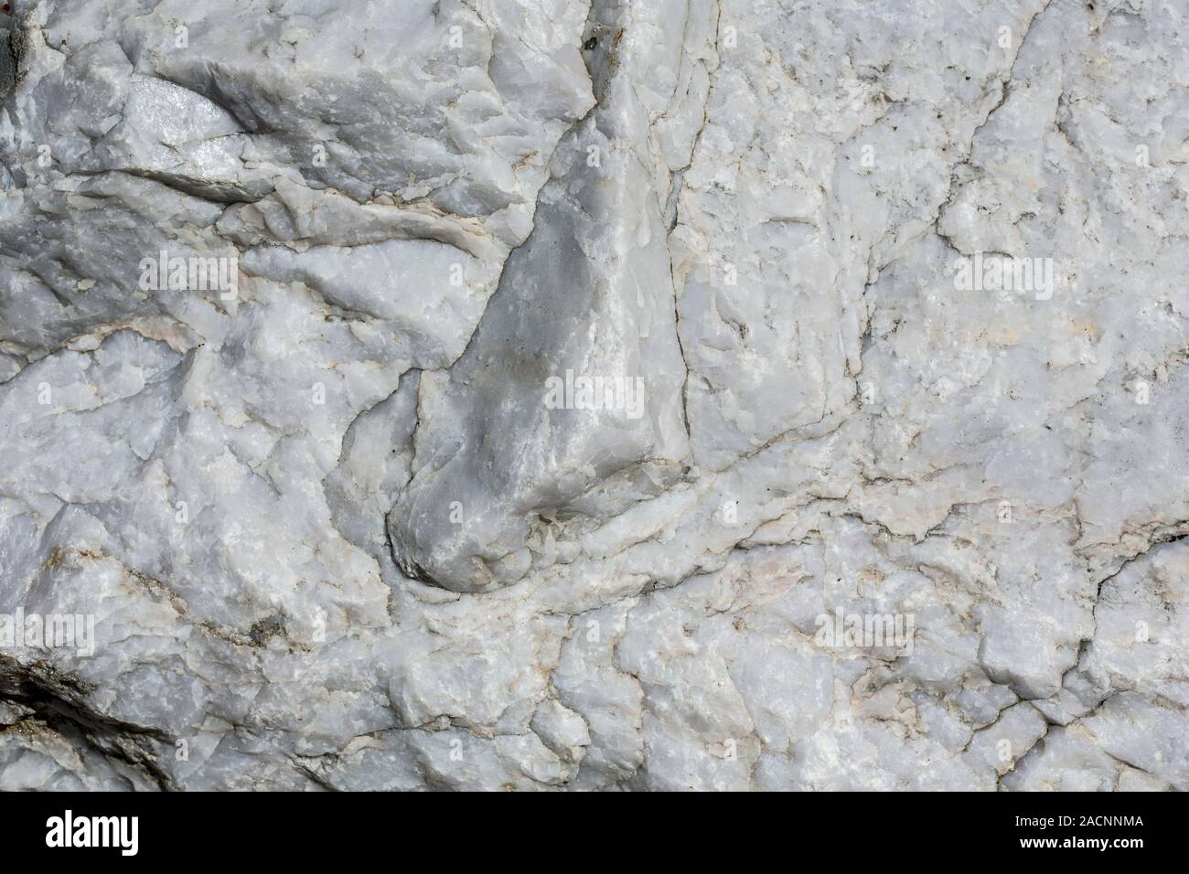 Quartz boulder, close-up. This silicate mineral is a form of silica ...