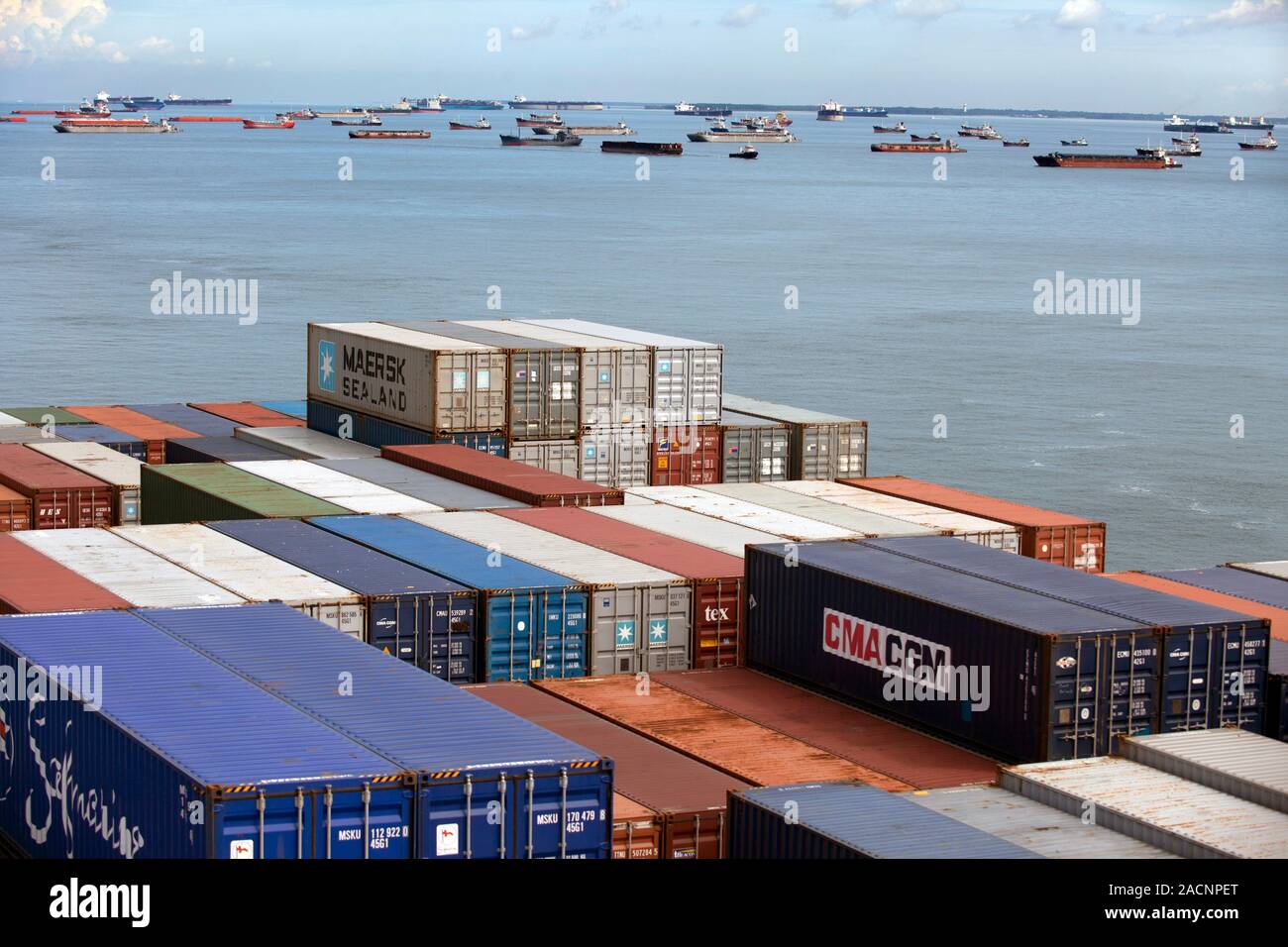 Singapore Strait shipping traffic. View across the deck of a container ...