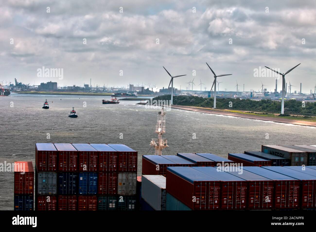 Port of Le Rotterdam. View across the deck of a container ship arriving ...