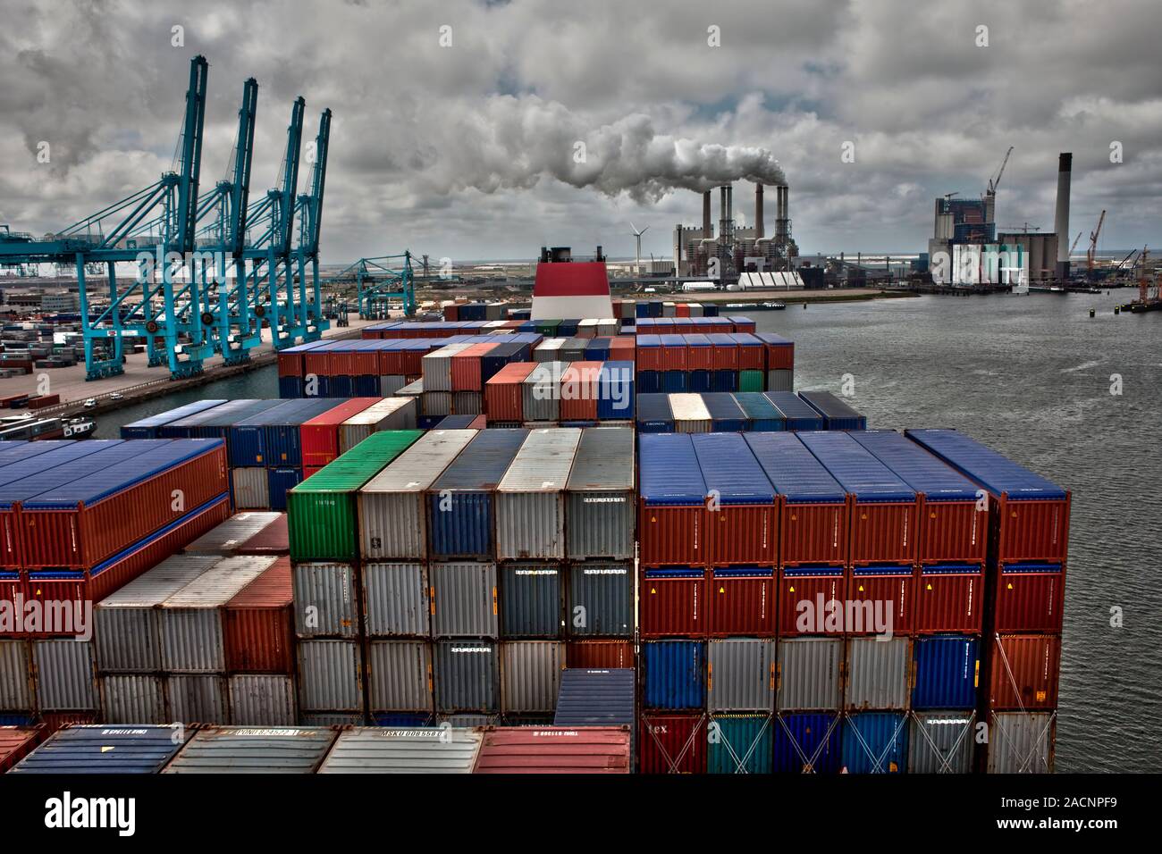 Port of Le Rotterdam. View across the deck of a container ship arriving ...